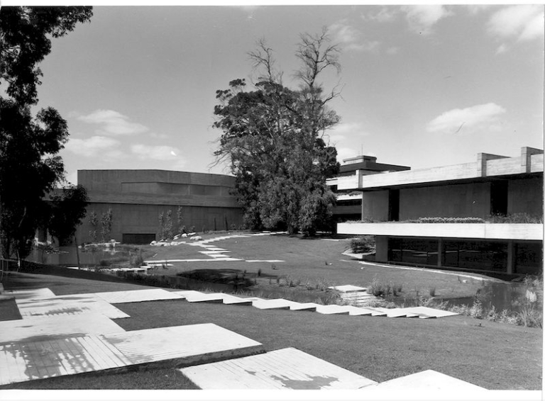 View of the lake and garden adjacent to the structure of the Auditorium ...
